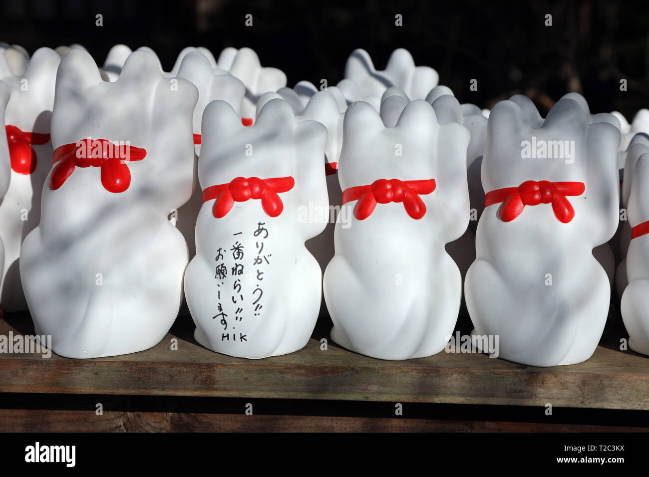 Maneki-Neko waving cat statues at the Gotokuji Temple in the Setagaya district of Tokyo in Japan ...