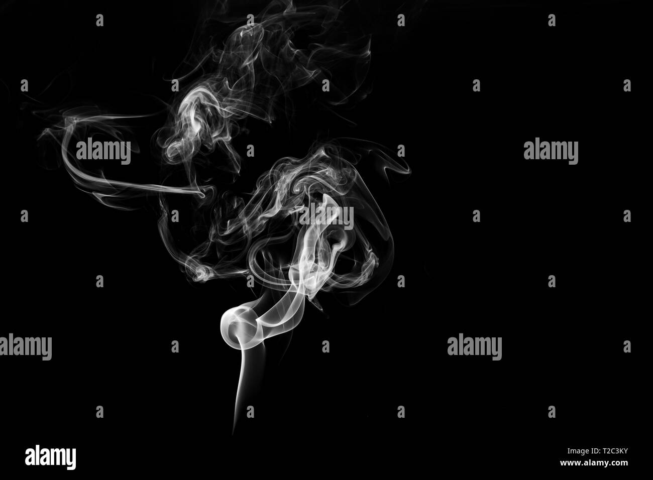white smoke flame on a black background Stock Photo - Alamy