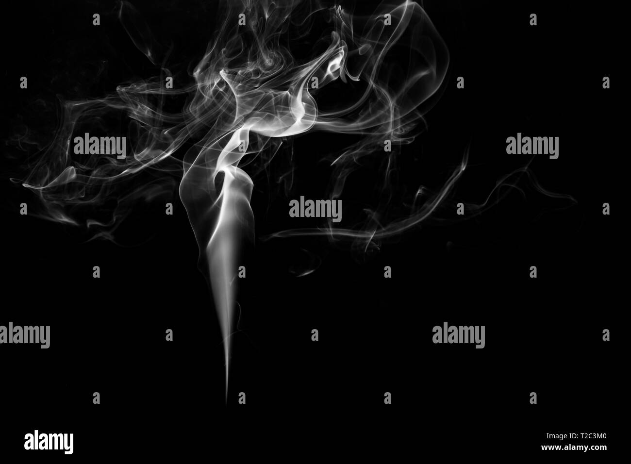white smoke flame on a black background Stock Photo - Alamy