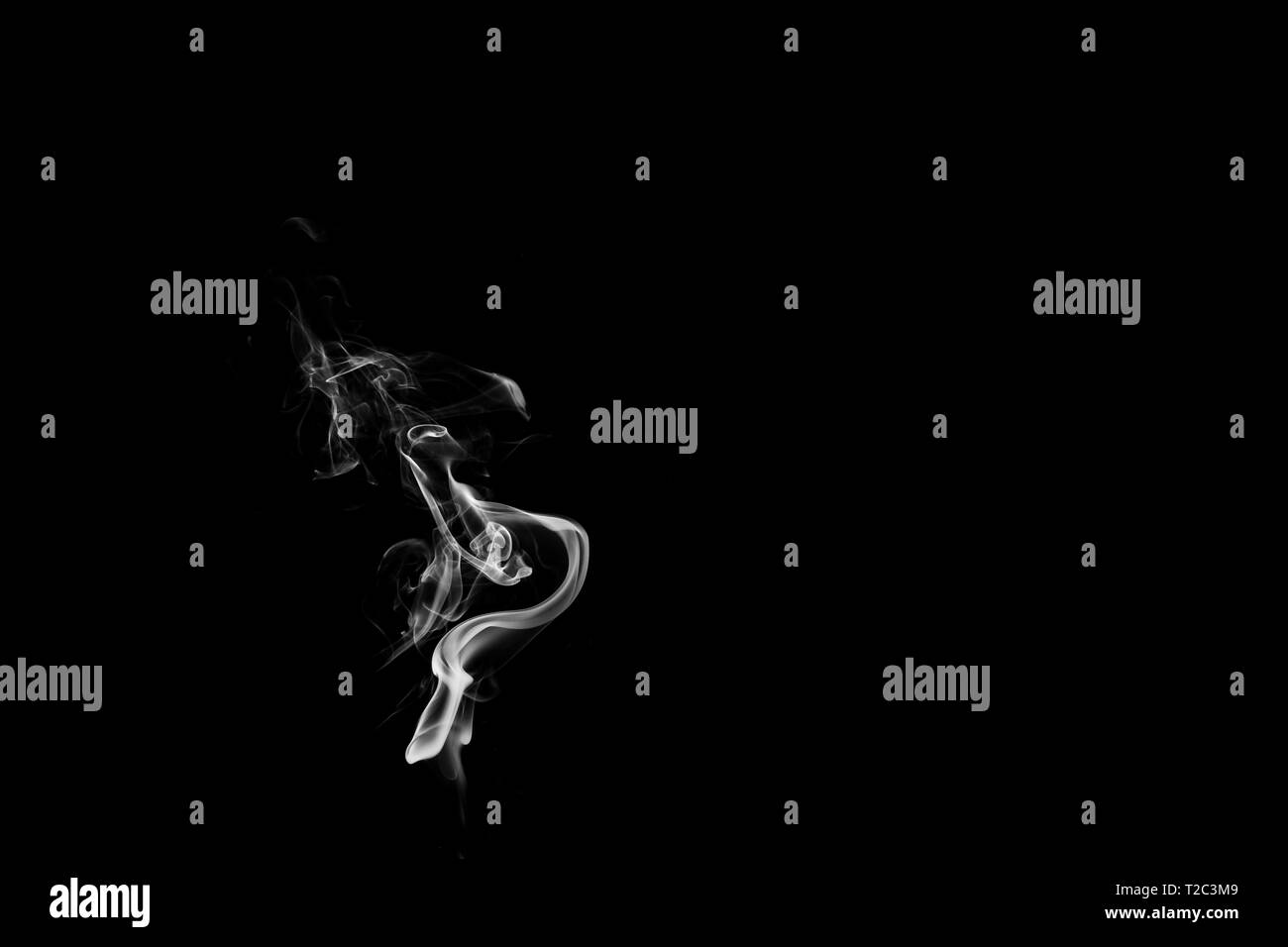 white smoke flame on a black background Stock Photo - Alamy