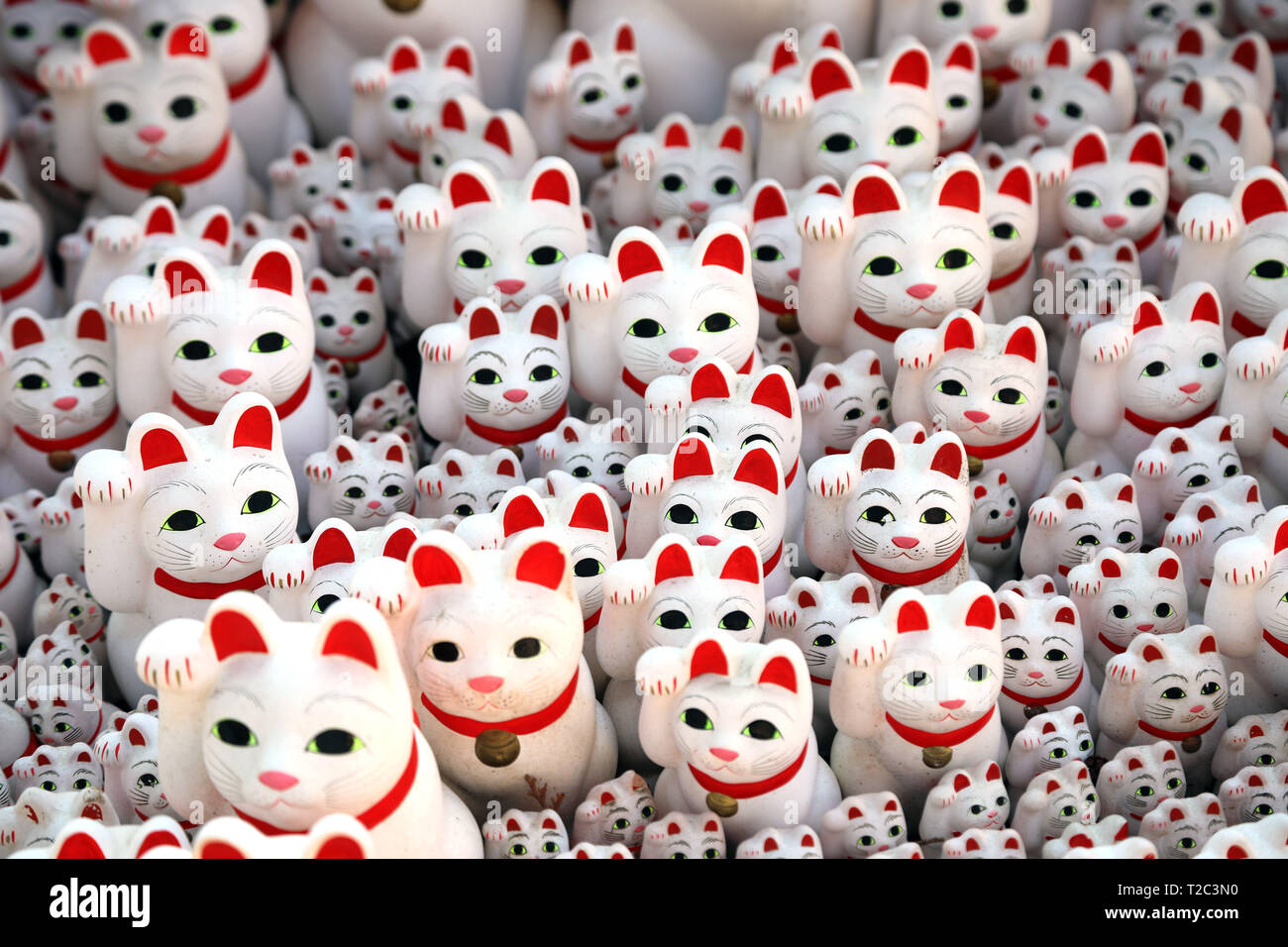 Maneki-Neko waving cat statues at the Gotokuji Temple in the Setagaya district of Tokyo in Japan ...