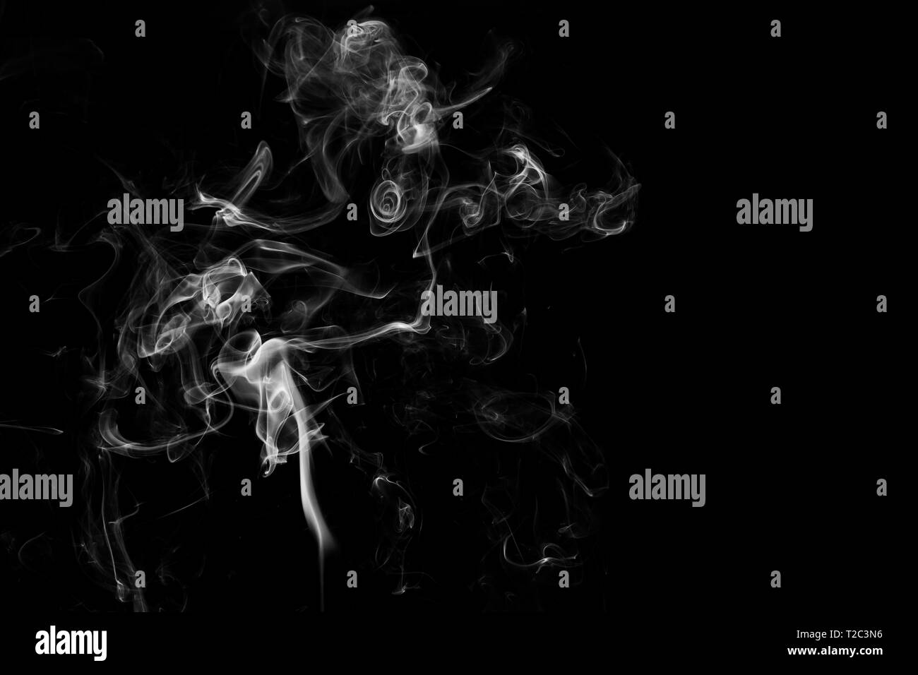 white smoke flame on a black background Stock Photo - Alamy