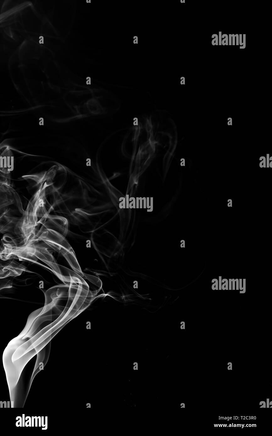 white smoke flame on a black background Stock Photo - Alamy