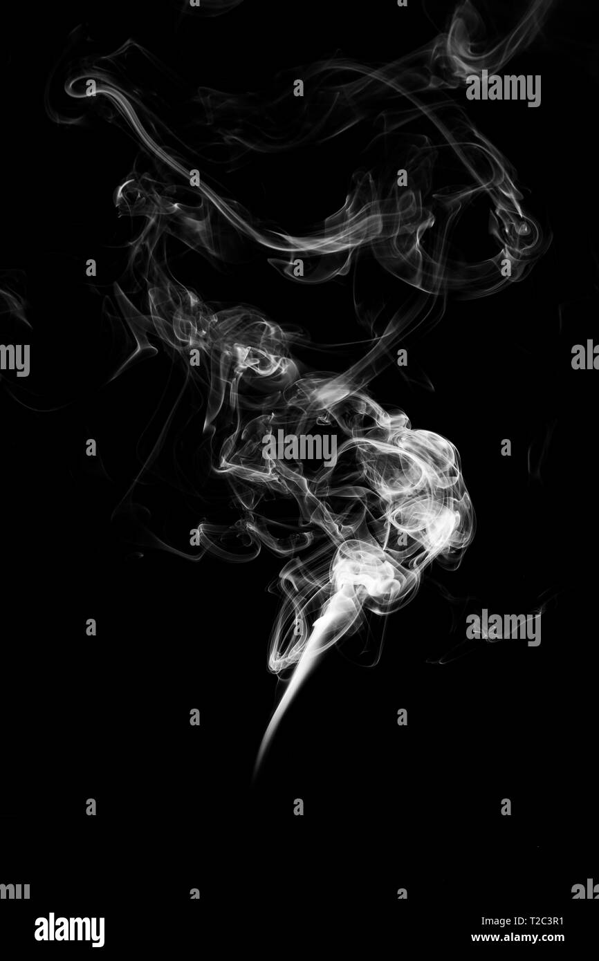 white smoke flame on a black background Stock Photo - Alamy