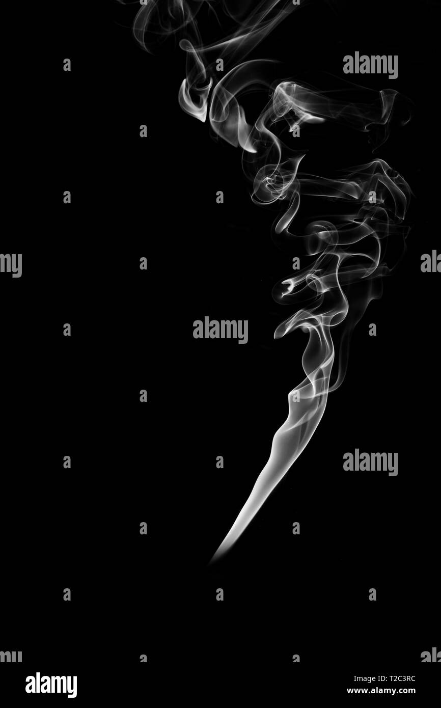 white smoke flame on a black background Stock Photo - Alamy