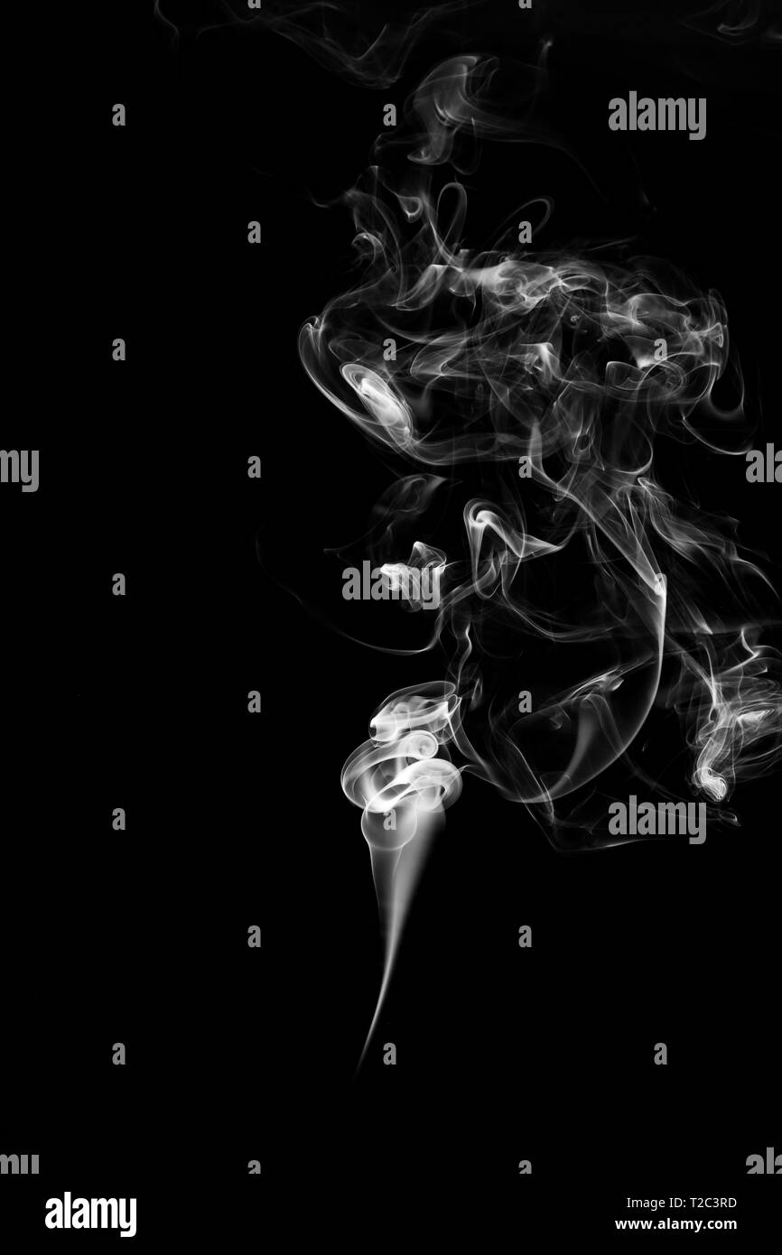 white smoke flame on a black background Stock Photo - Alamy