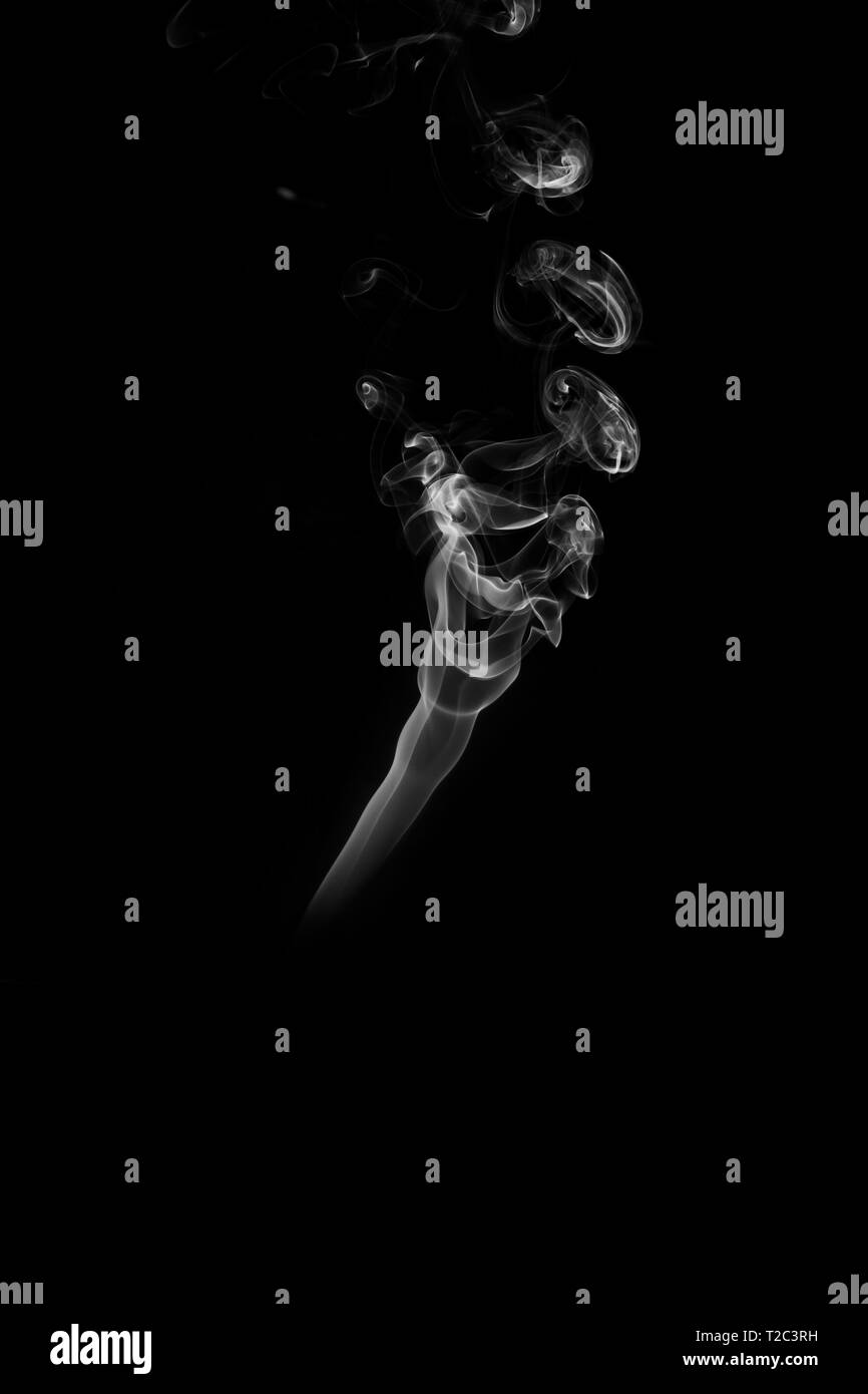 white smoke flame on a black background Stock Photo - Alamy