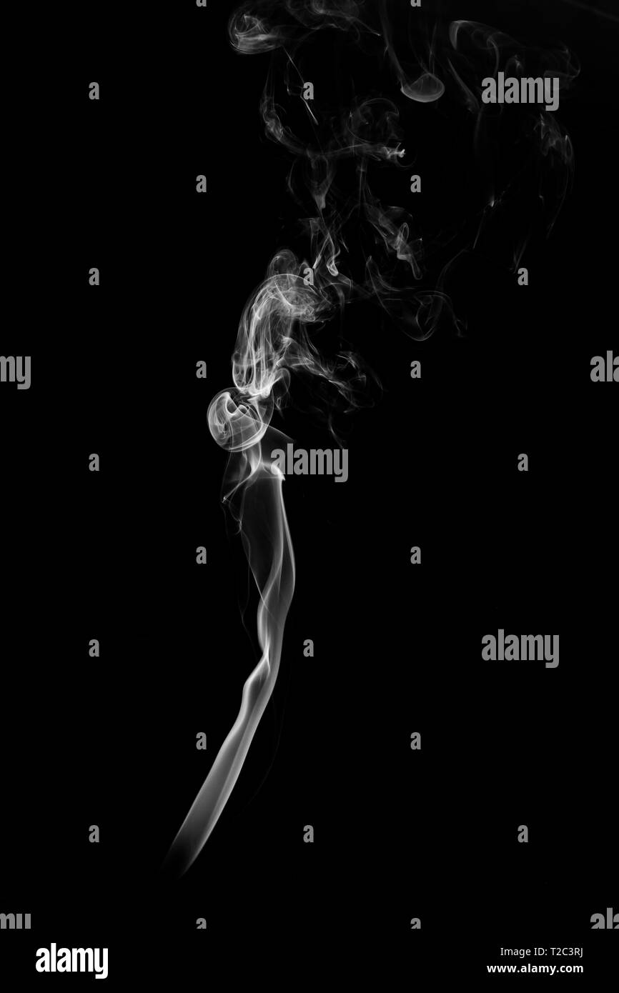 white smoke flame on a black background Stock Photo - Alamy
