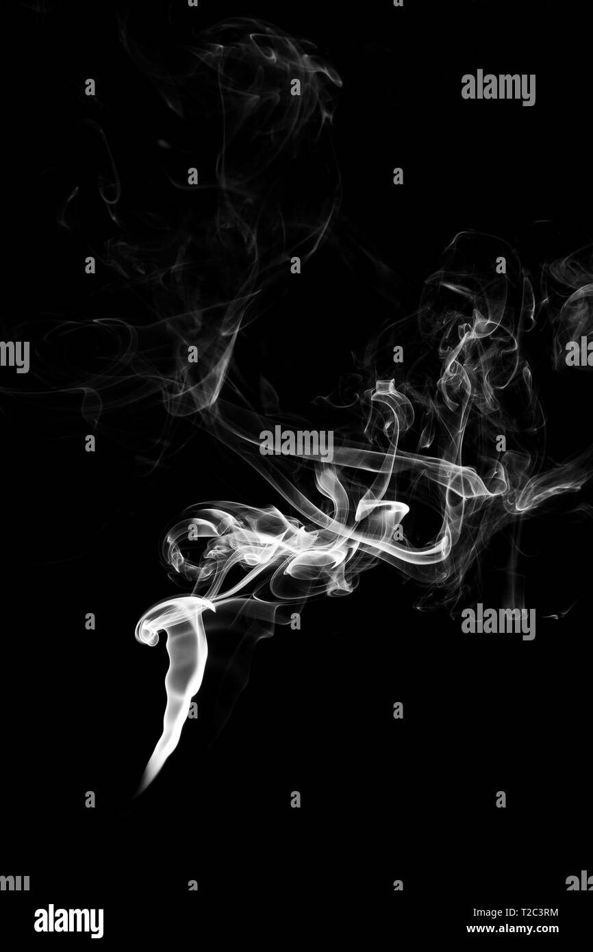 white smoke flame on a black background Stock Photo - Alamy