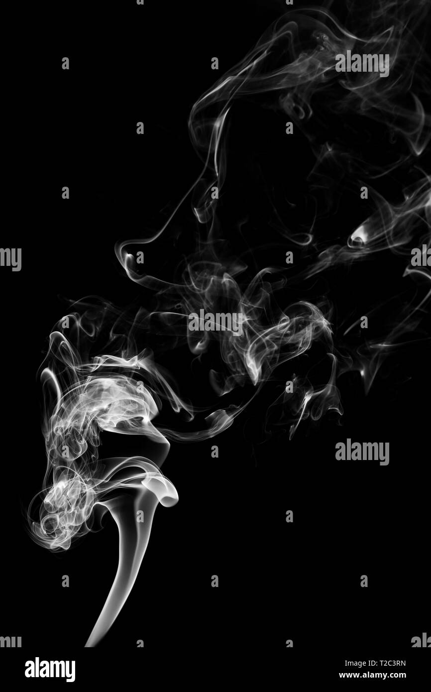 white smoke flame on a black background Stock Photo - Alamy