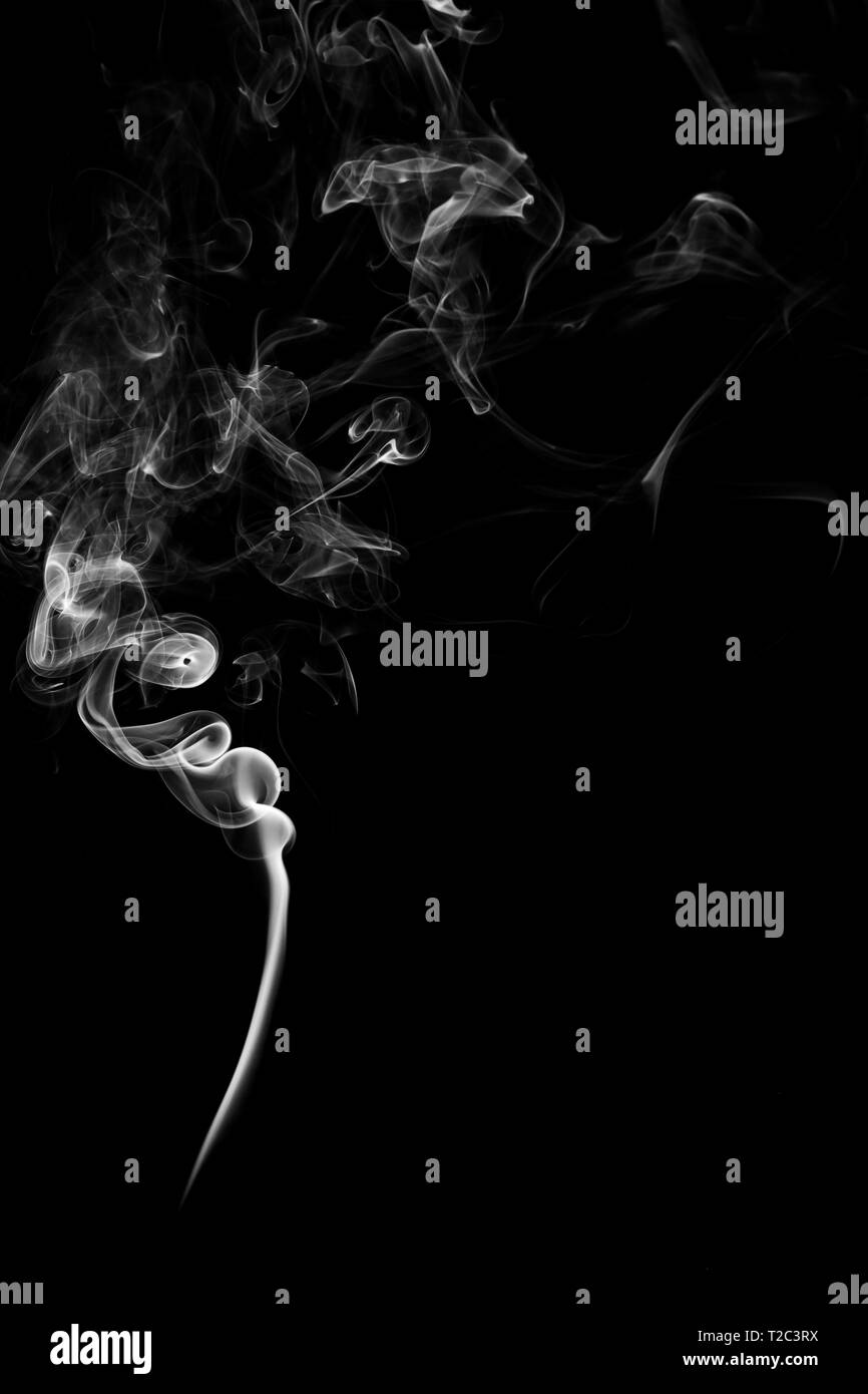 white smoke flame on a black background Stock Photo - Alamy
