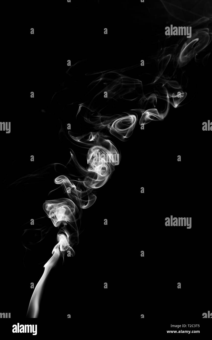 white smoke flame on a black background Stock Photo - Alamy