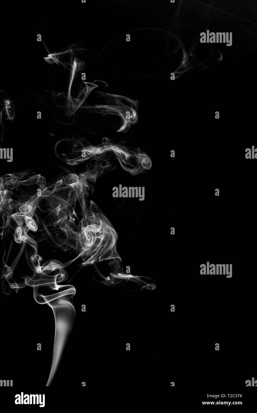 white smoke flame on a black background Stock Photo - Alamy