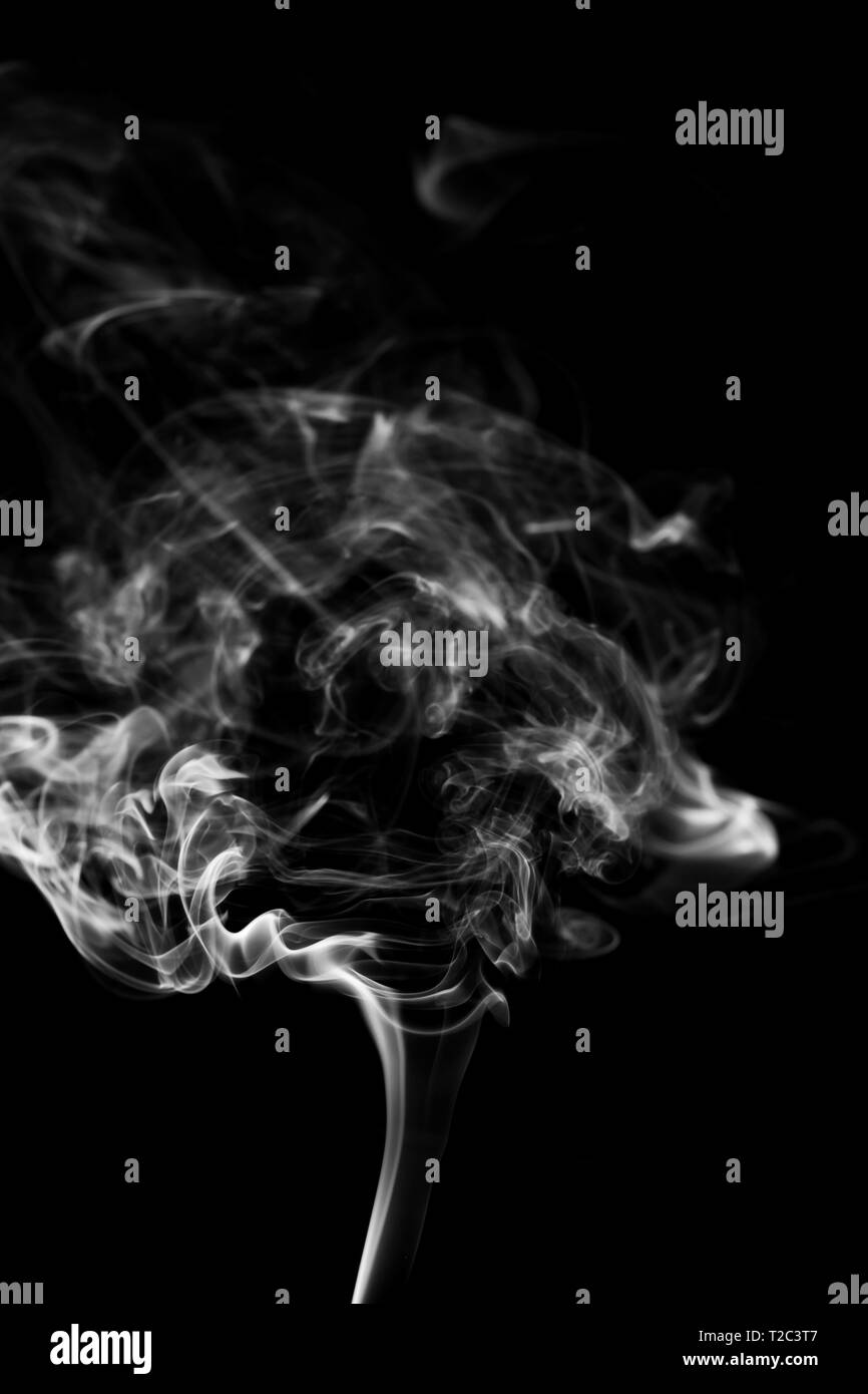 white smoke flame on a black background Stock Photo - Alamy