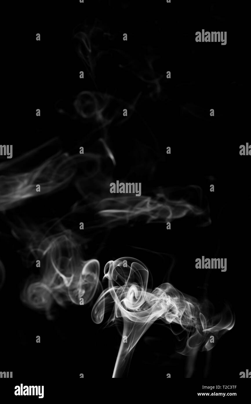 white smoke flame on a black background Stock Photo - Alamy