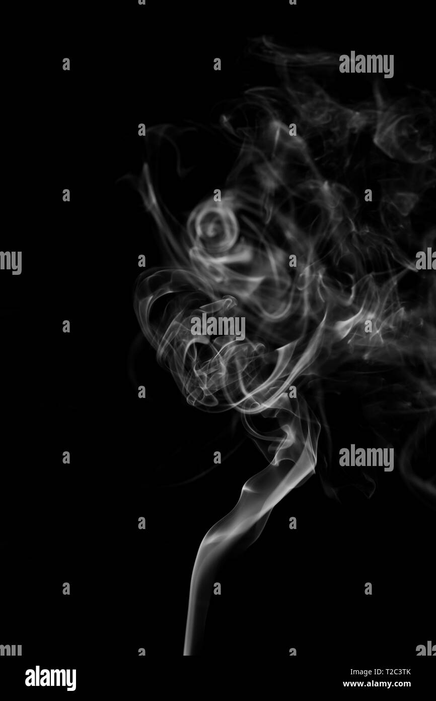 white smoke flame on a black background Stock Photo - Alamy