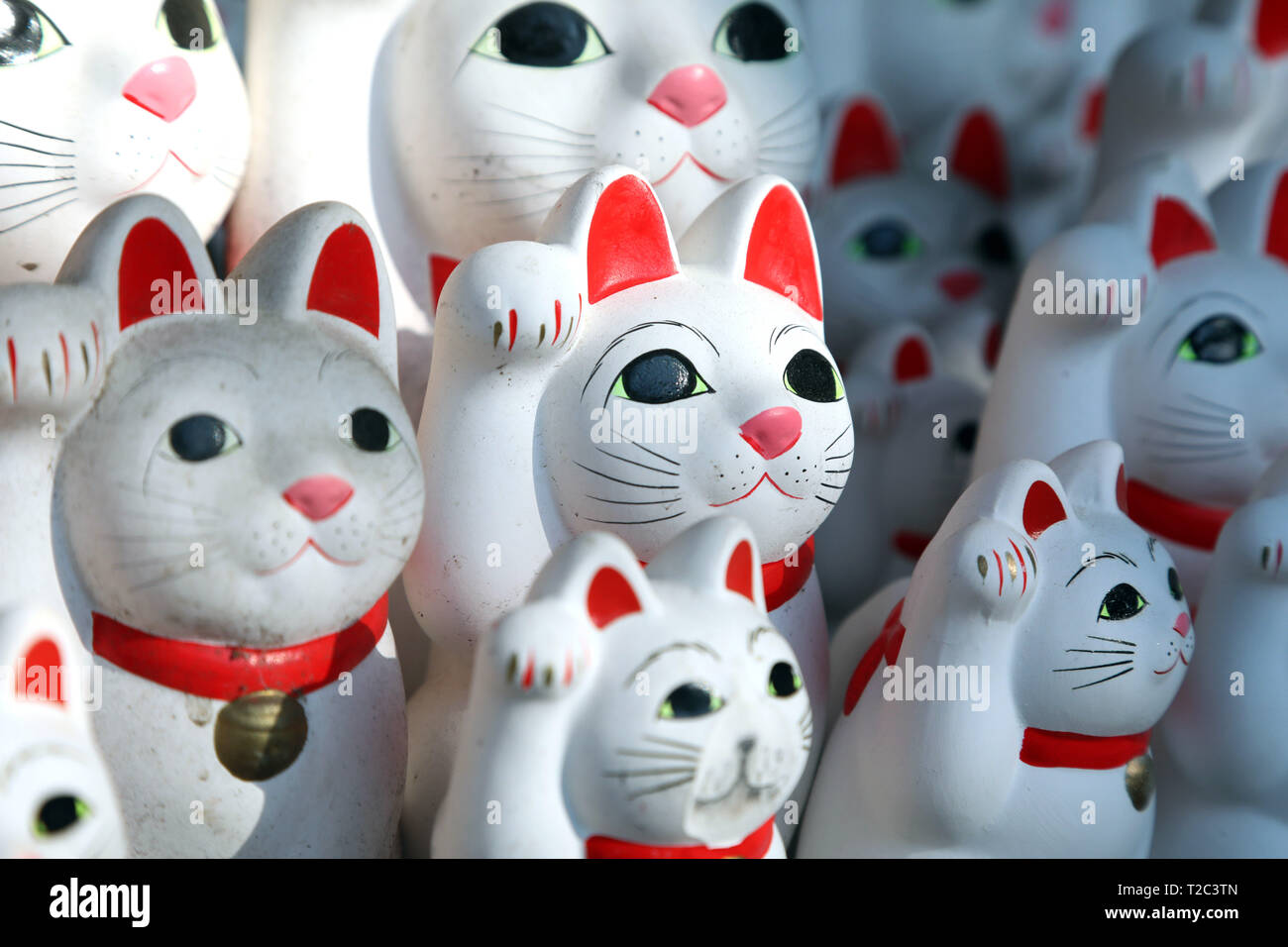 Maneki-Neko waving cat statues at the Gotokuji Temple in the Setagaya district of Tokyo in Japan ...