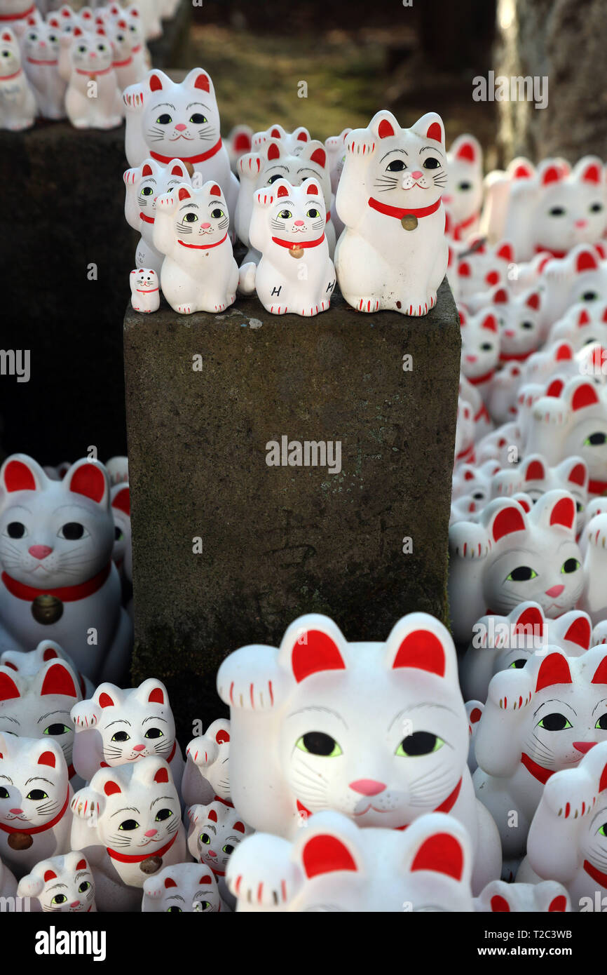 Maneki-Neko waving cat statues at the Gotokuji Temple in the Setagaya district of Tokyo in Japan ...