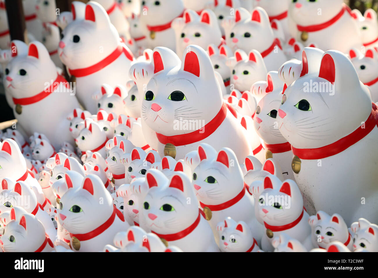 Maneki-Neko waving cat statues at the Gotokuji Temple in the Setagaya district of Tokyo in Japan ...