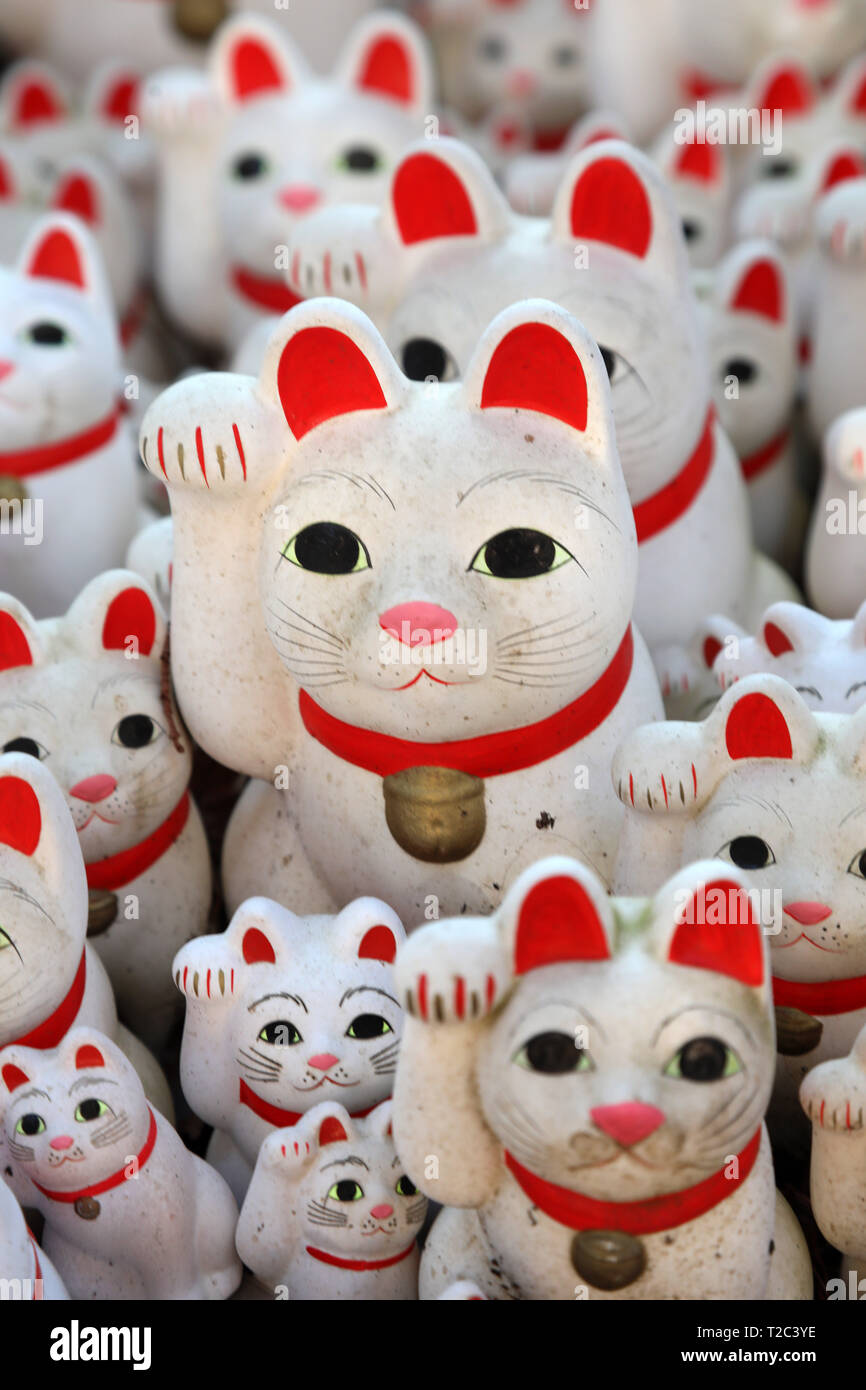 Maneki-Neko waving cat statues at the Gotokuji Temple in the Setagaya district of Tokyo in Japan ...