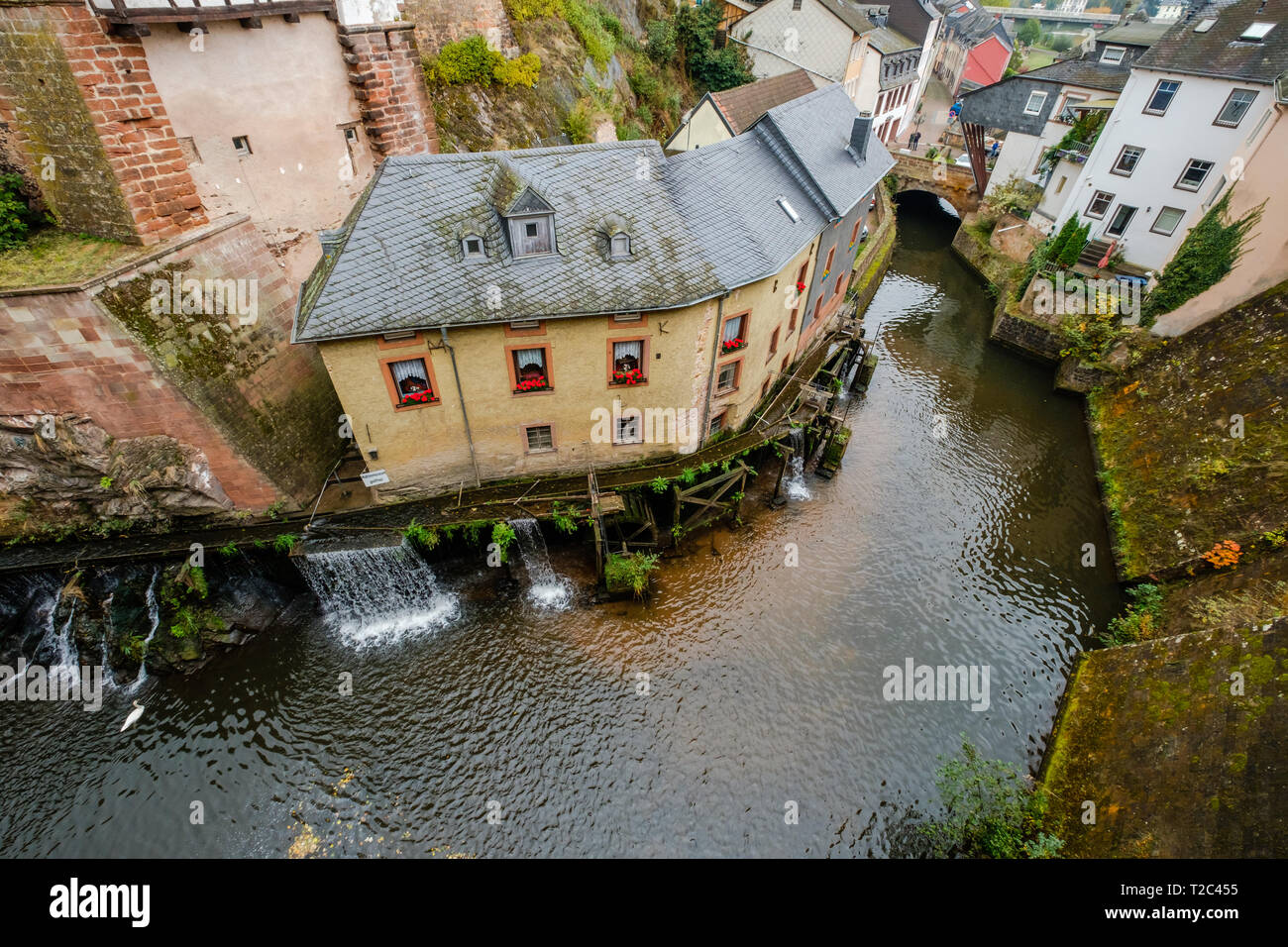 River Saar with waterfall and water mills in the historic town of ...
