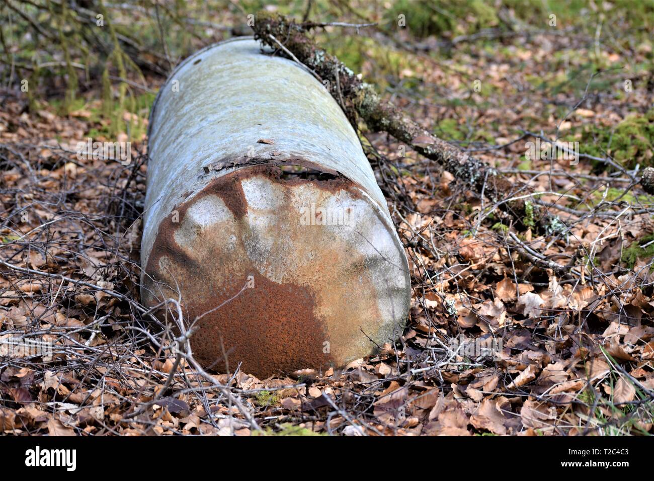 Long view of rusty, galvanised, cylindrical, water tank abandoned in a ...