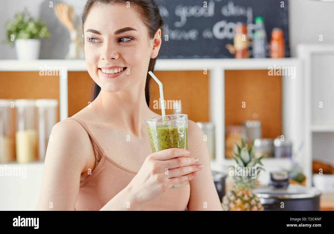 a young girl drinks a cocktail on a kitchen Stock Photo - Alamy