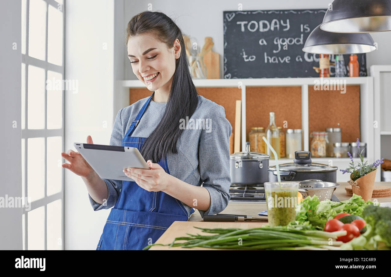 Woman cooking tablet hi-res stock photography and images - Alamy
