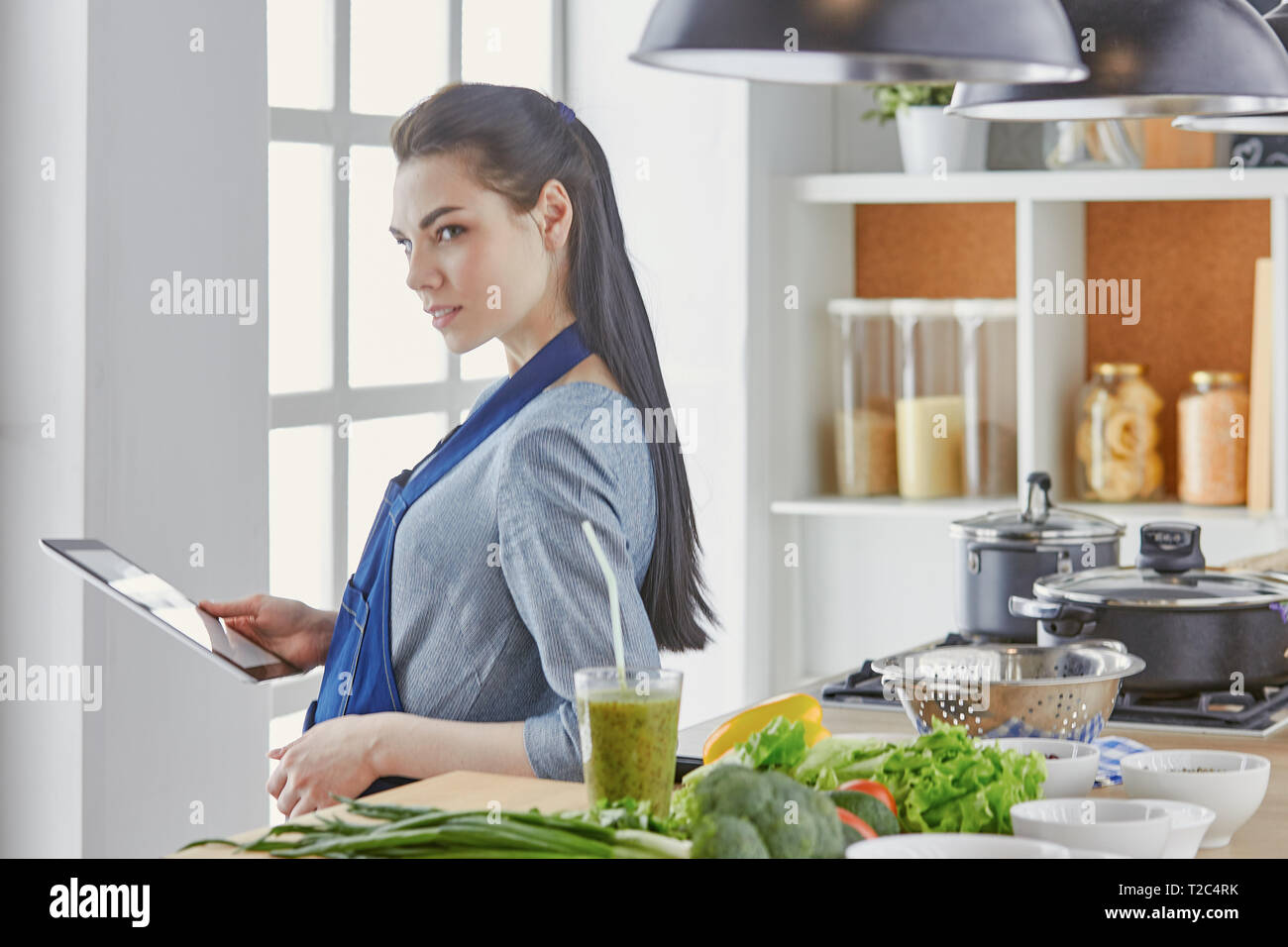 Woman cooking tablet hi-res stock photography and images - Alamy