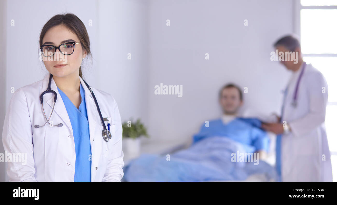 Doctor checking heart beat of patient in bed with stethoscope Stock ...