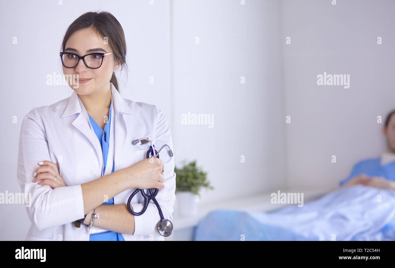Doctor checking heart beat of patient in bed with stethoscope Stock ...