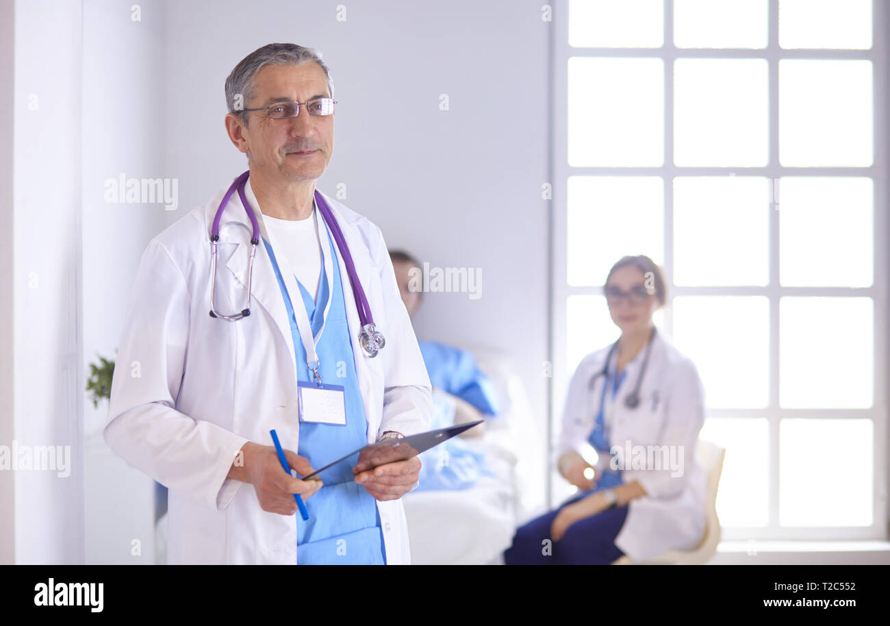 Doctor checking heart beat of patient in bed with stethoscope Stock ...