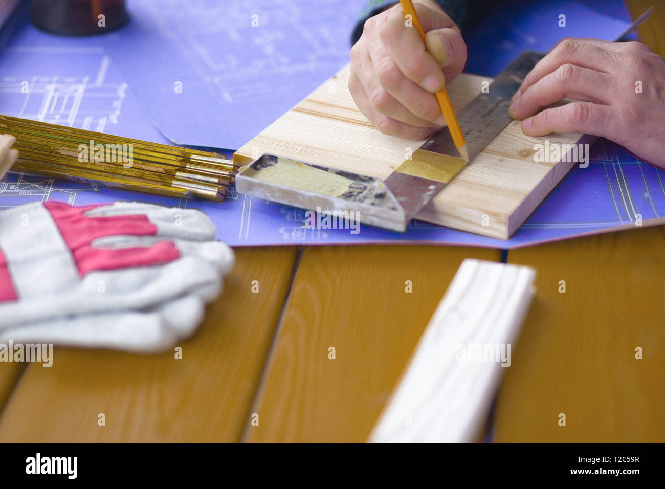 Engineer carpenter working on laptop and sketching project Stock Photo ...