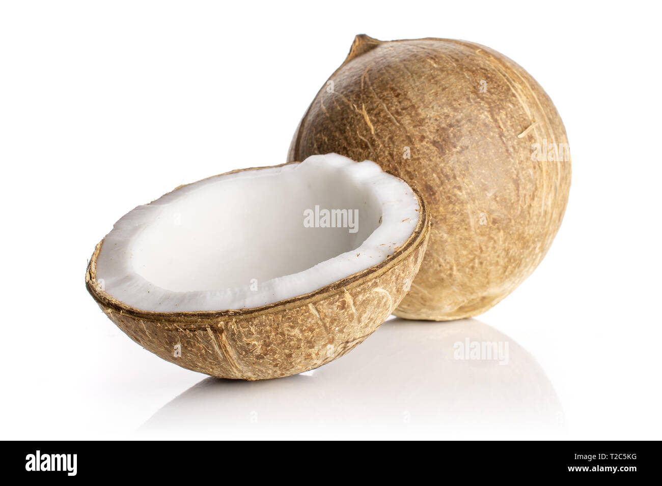Group of one whole one half of fresh bio coconut isolated on white ...