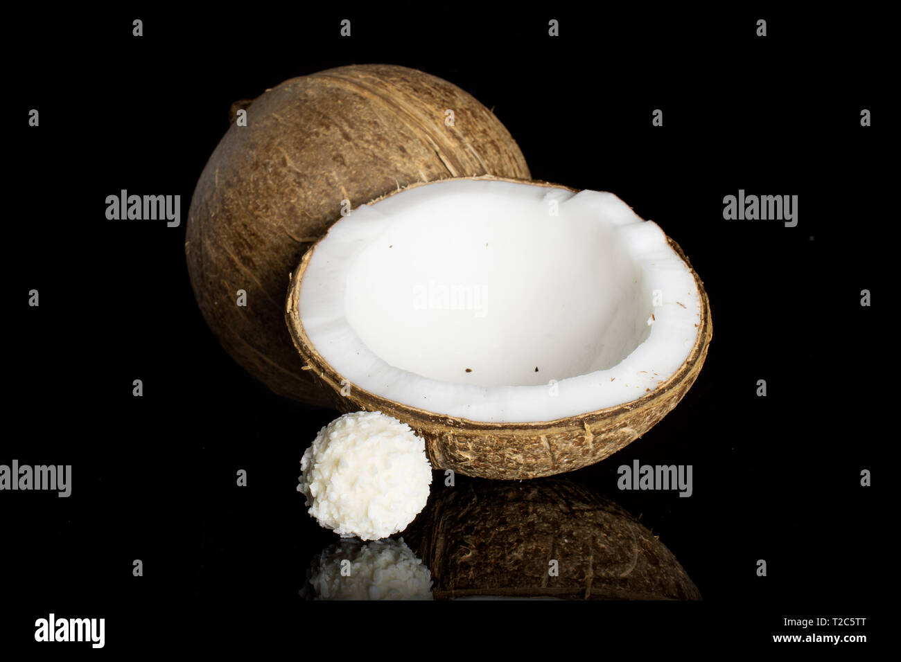 Group of one whole one half of fresh bio coconut with a small cocoa ...