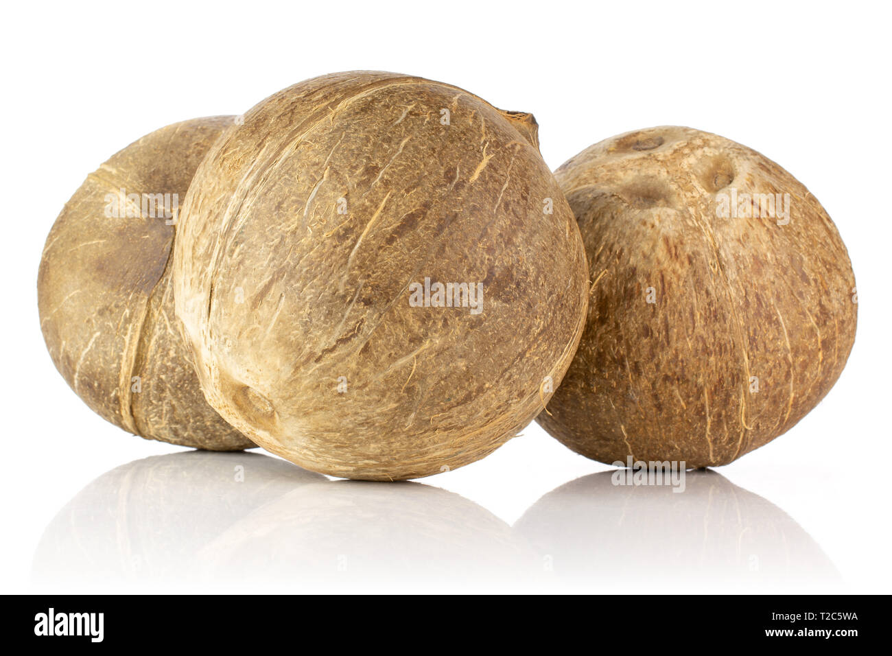 Group of three whole fresh bio coconut isolated on white background ...
