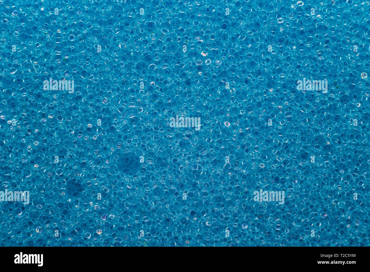 Extreme macro shot of a blue dish wash sponge showing the structure of ...