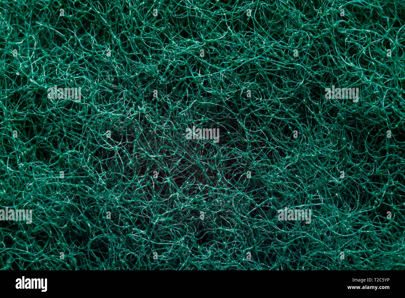 Extreme macro shot of the rough part of a dish wash sponge showing the ...