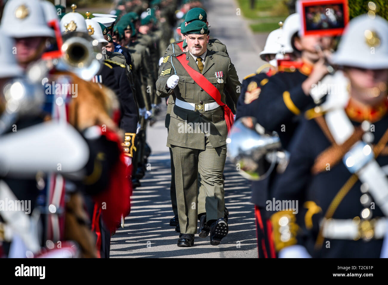 A Royal Marine marches behind the band of Her Majesty's Royal Marines ...
