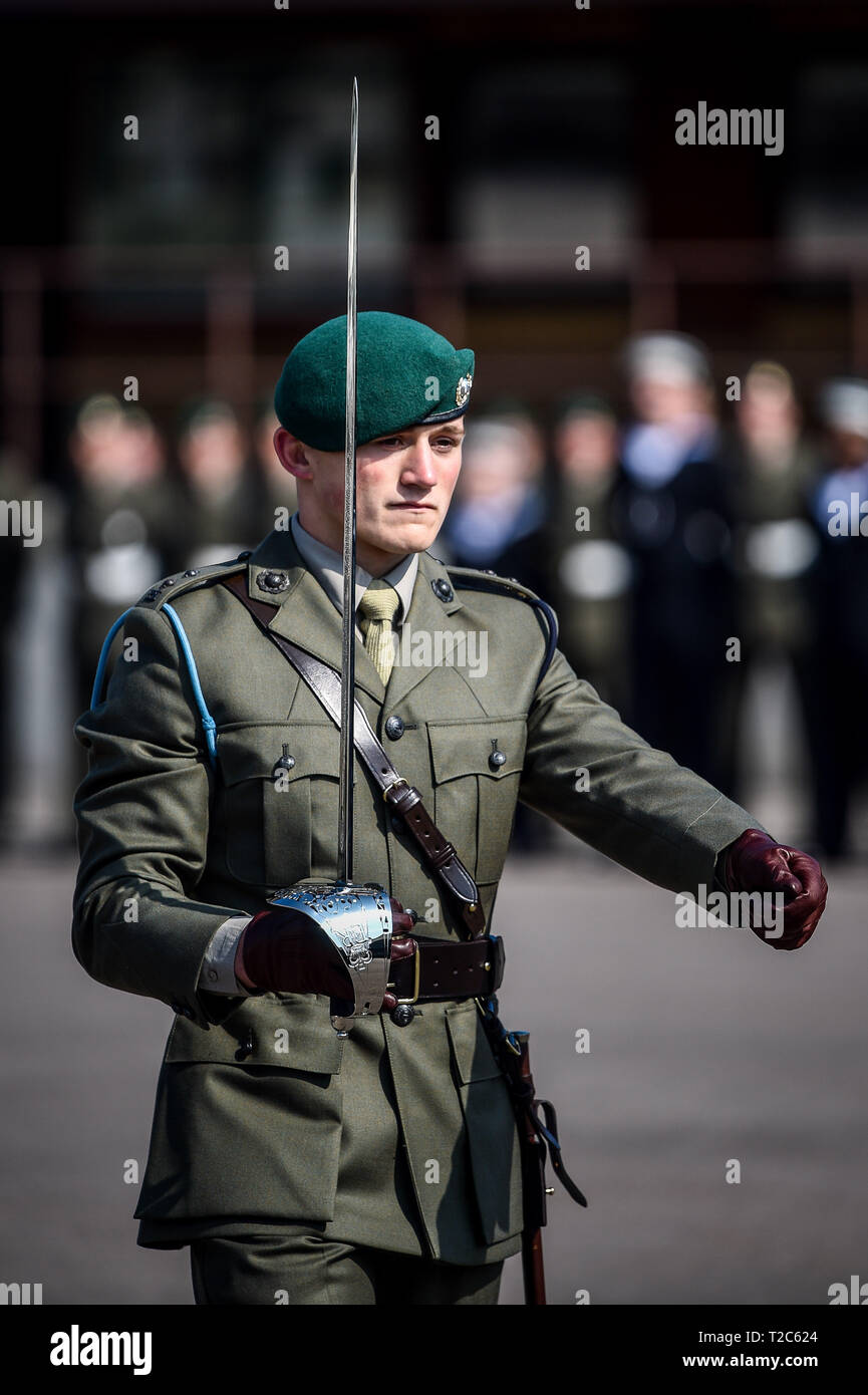 Royal Marines officer Lieutenant Henry Hives carries the Sword of Peace ...