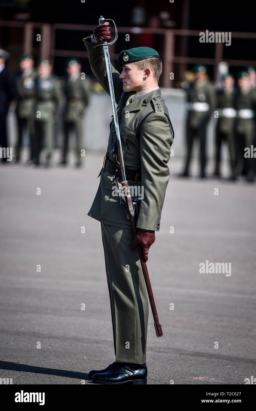 Royal Marines officer Lieutenant Henry Hives sheathes the Sword of ...