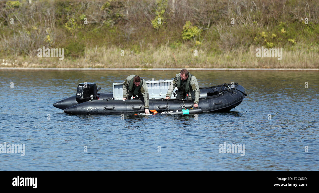 Royal Navy personel demonstrating their underwater Remus drone during a ...