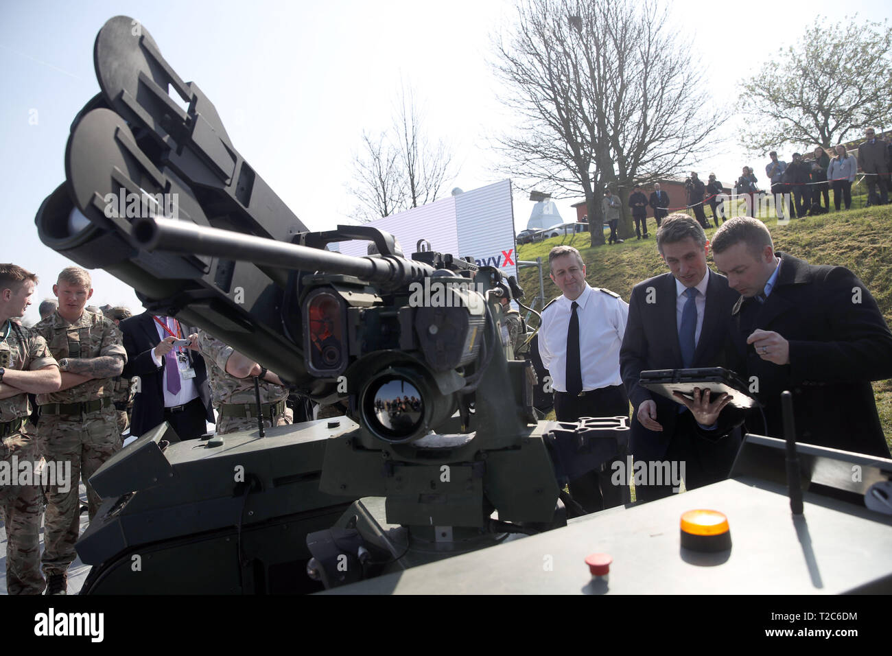 Defence Secretary Gavin Williamson (second right) looks at an ...