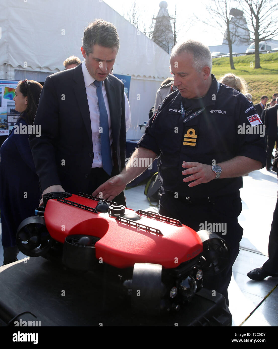 Defence Secretary Gavin Williamson (left) looks at an underwater drone ...