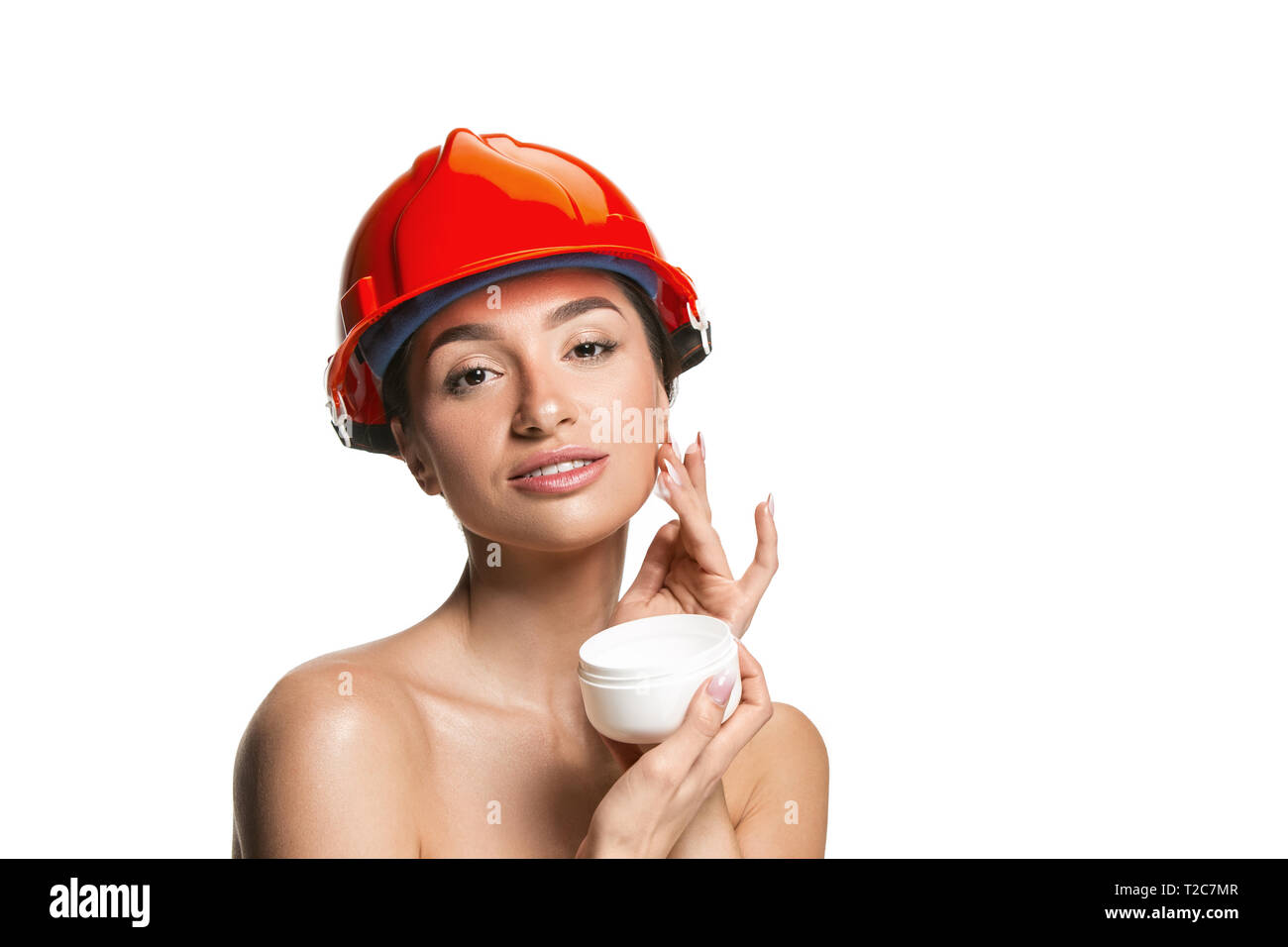 Portrait of confident female happy smiling worker in orange helmet ...