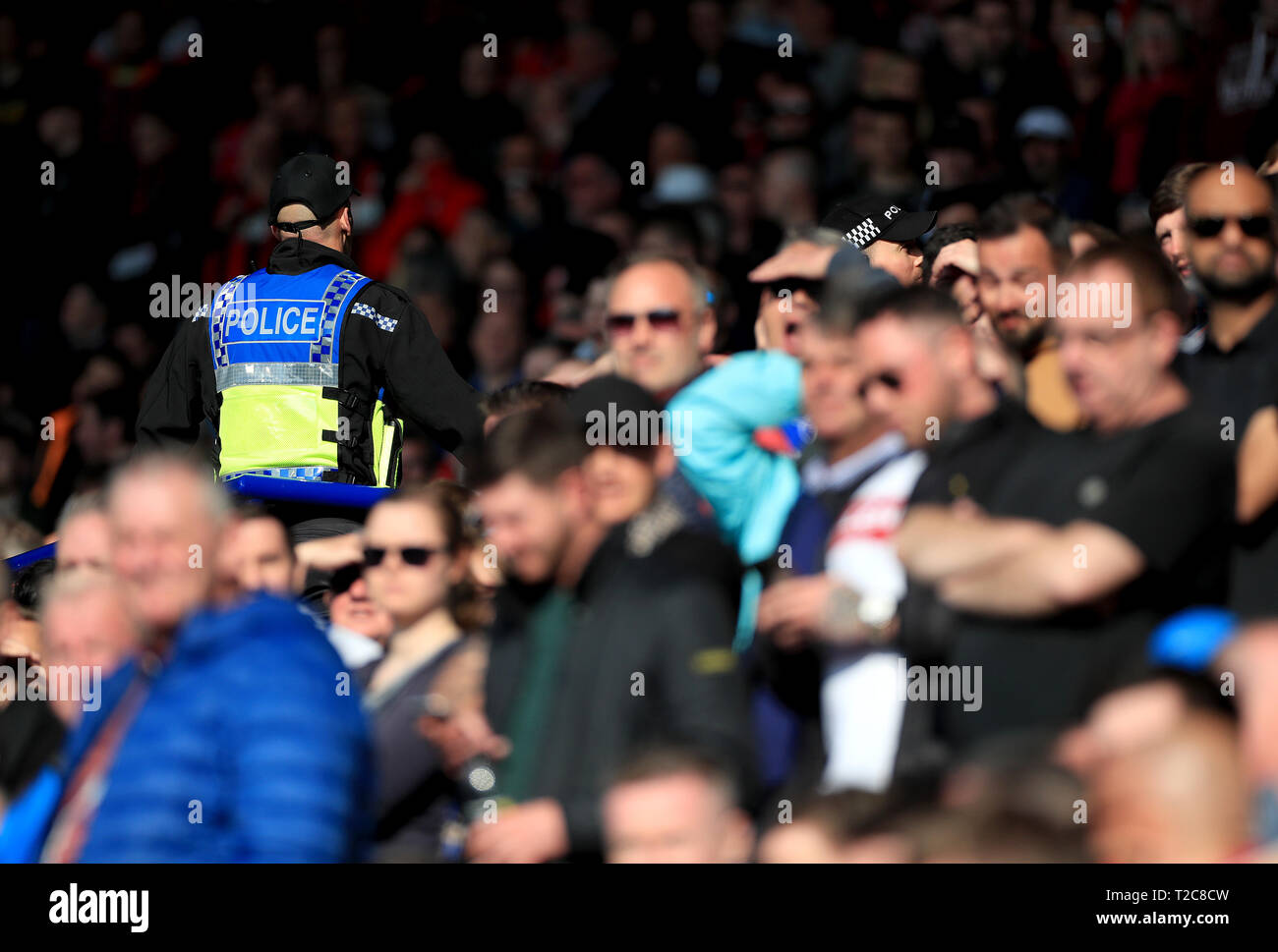 Police keep watch over fans in the stands Stock Photo - Alamy