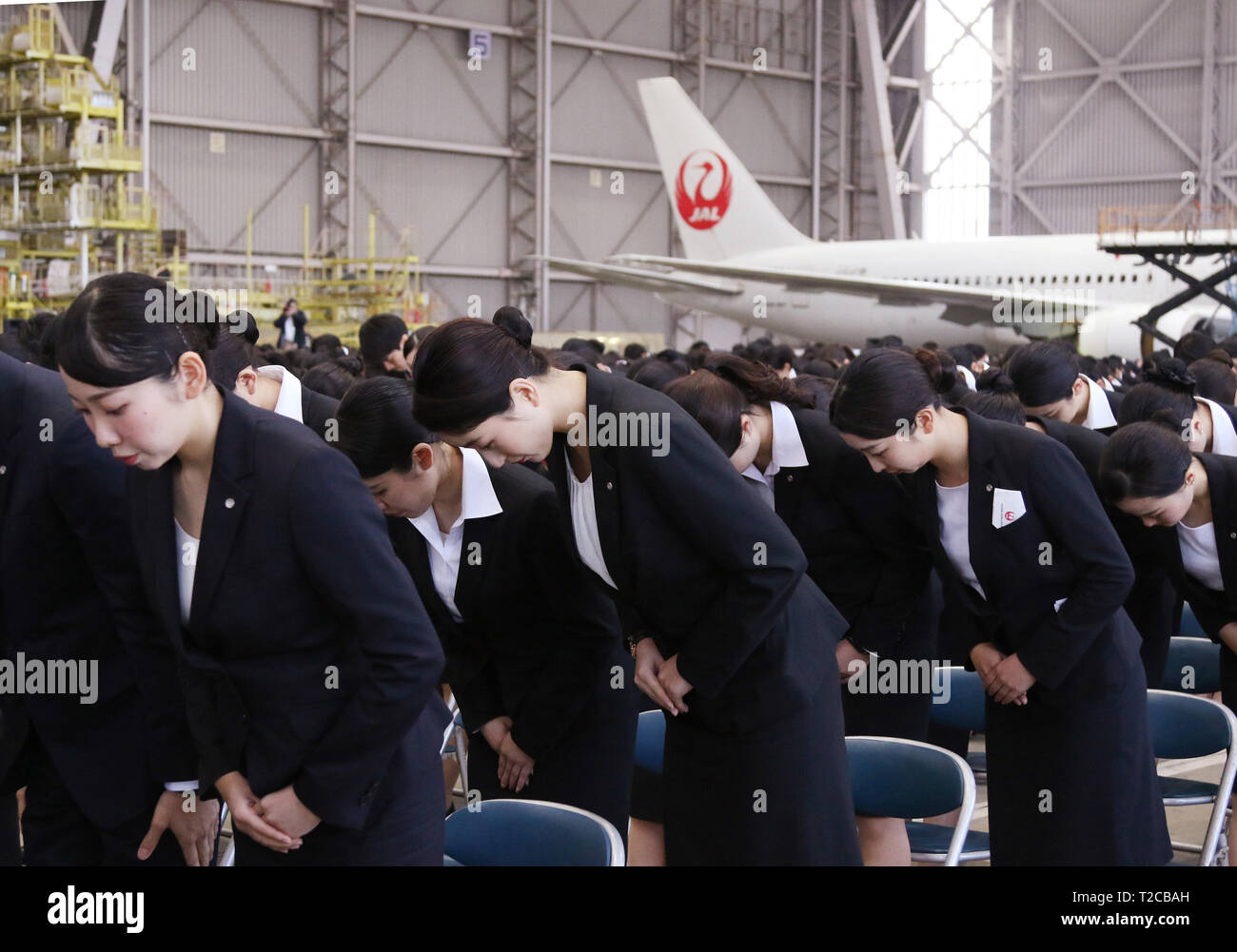 Tokyo, Japan. 1st Apr, 2019. Newly hired employees of Japan Airlines ...
