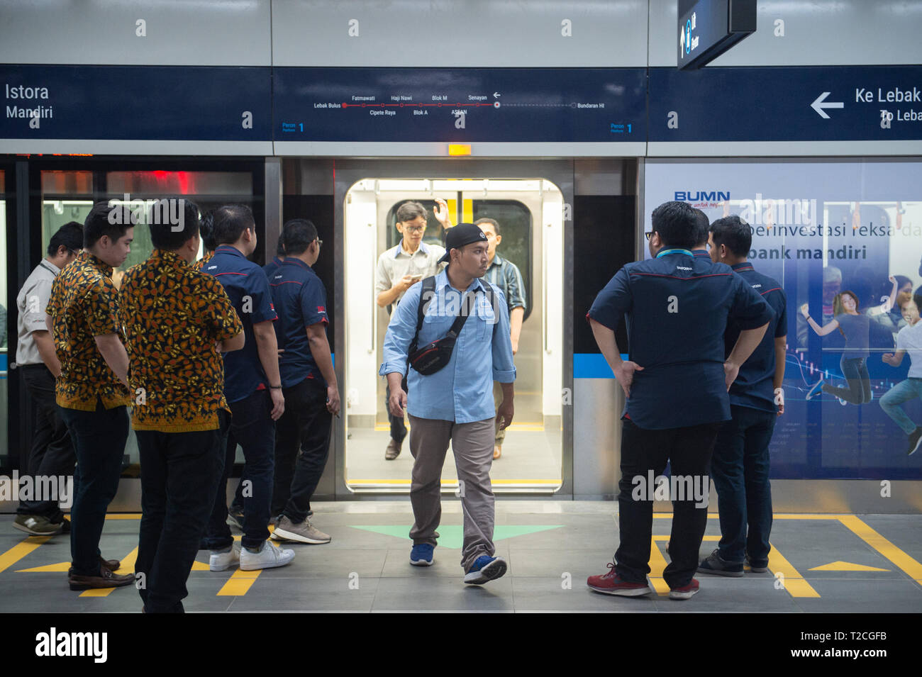 Jakarta, Indonesia. 1st Apr, 2019. Passengers get off a subway train at ...