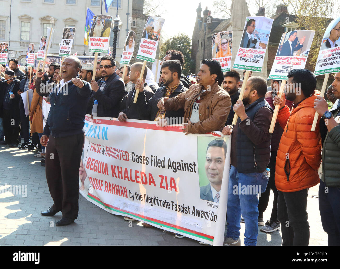 London, UK. 1st Apr, 2019. Protesters are seen holding a banner and ...