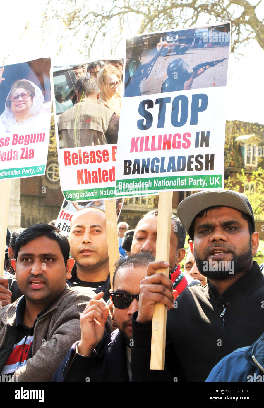 Protesters are seen holding placards during the demonstration ...